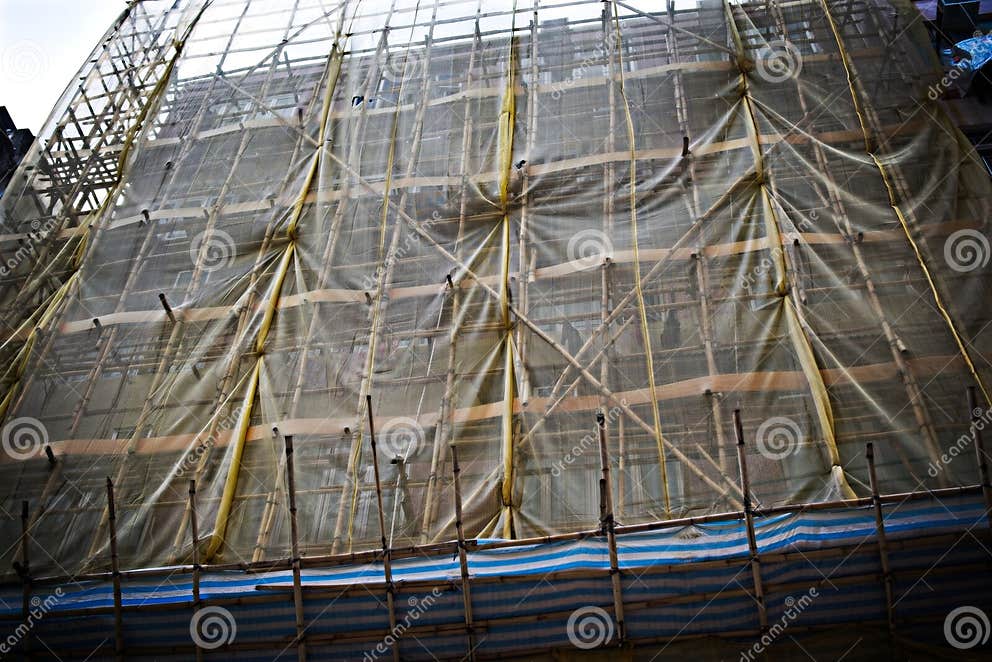 Construction Site with Scaffolding and Protective Mesh Stock Photo ...