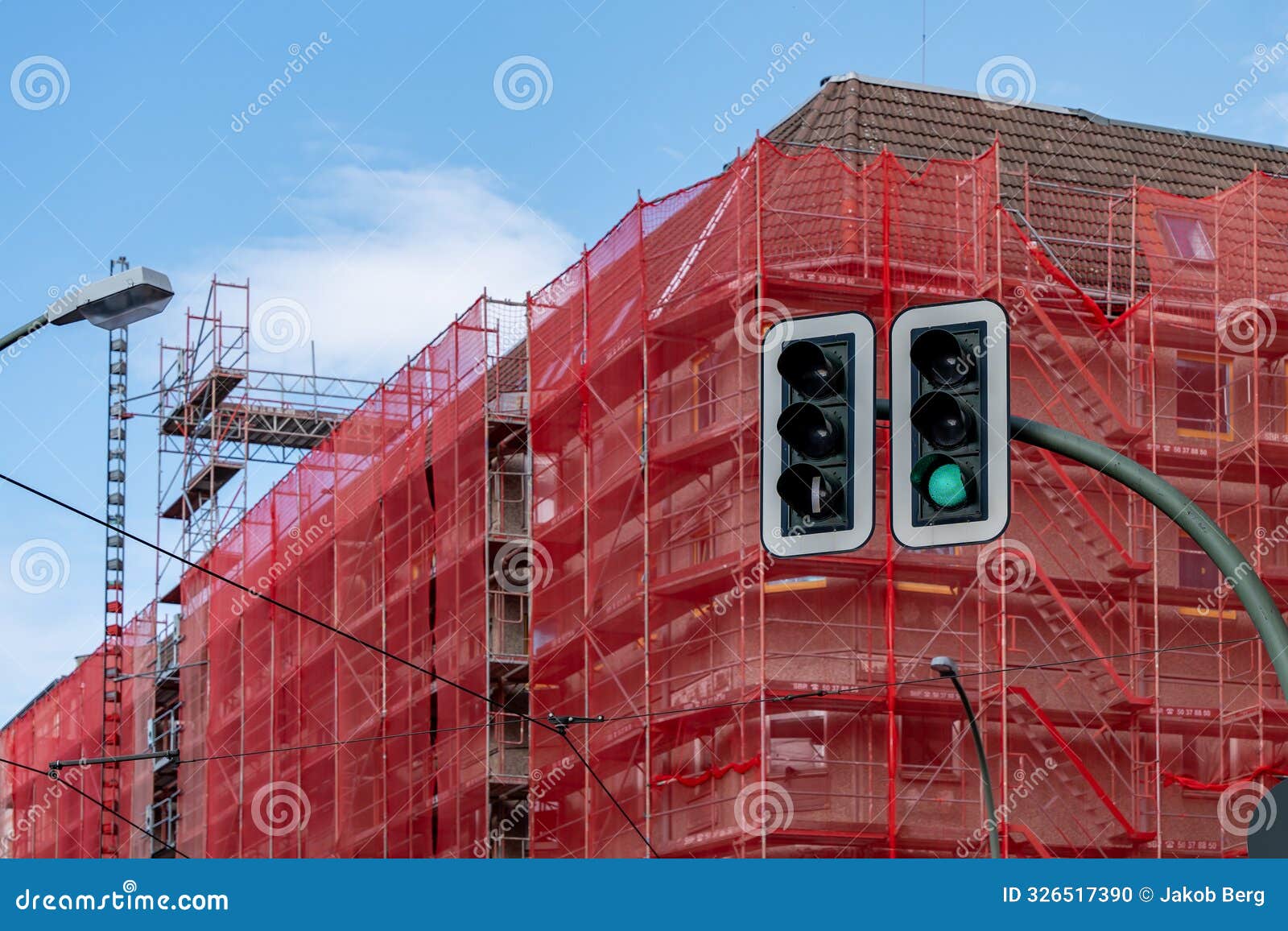 A Construction Site with Scaffolding and a Red and White Construction ...