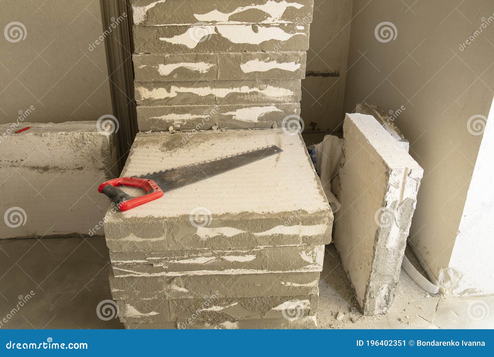 Construction Site with Stack of Gas Concrete Blocks and Mechanical Hand ...