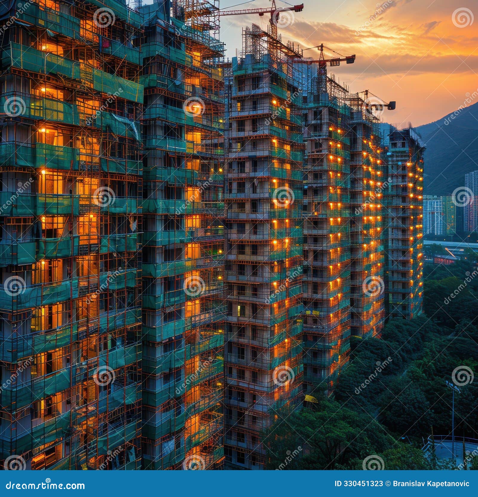 Construction Site At Sunset Featuring Concrete Hoists And Cranes In An ...