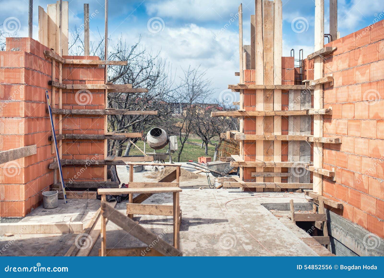 Construction Site, Tools, Wheel Barrow, Sand and Bricks at New House ...