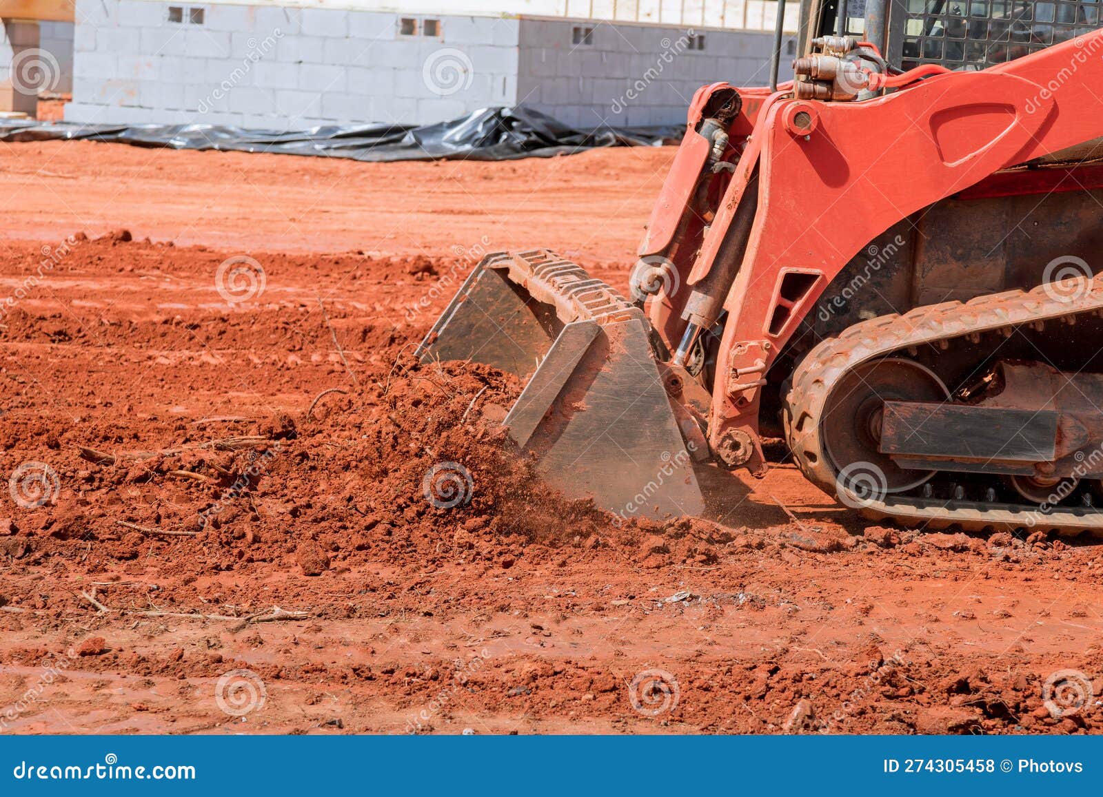In a Construction Site, a Tractor Digger Scoop Moves and Aligns Itself ...