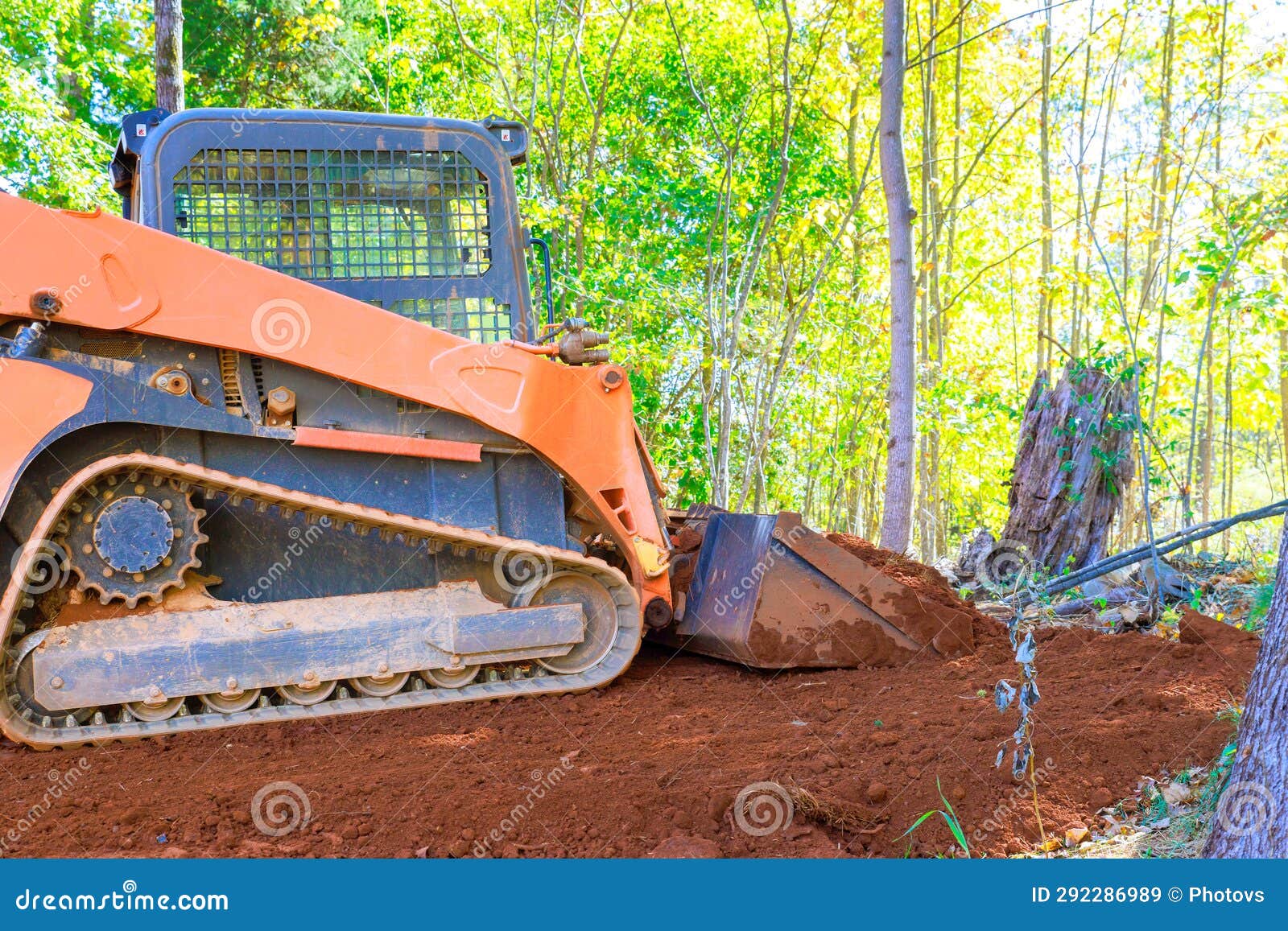 On Construction Site, Tractor is Leveling Ground for Construction of a ...