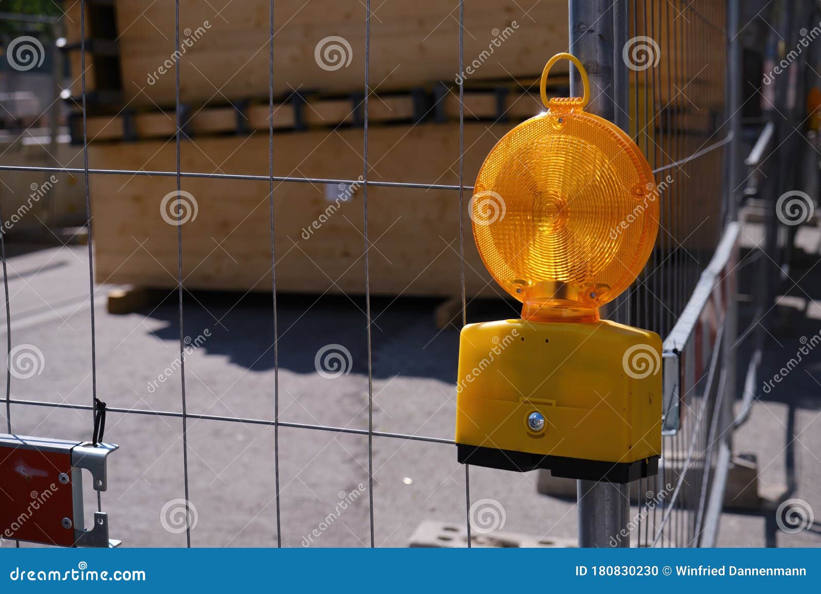 Construction Site Warning Lamp on a Construction Fence in Front of a ...