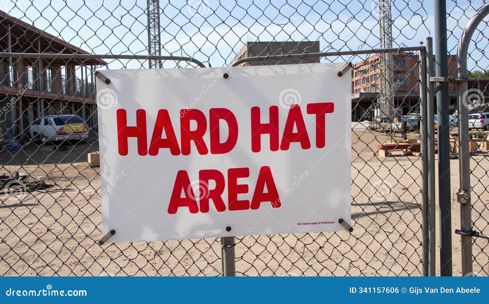 Construction Site Warning Sign on Metal Fence with Cranes and ...