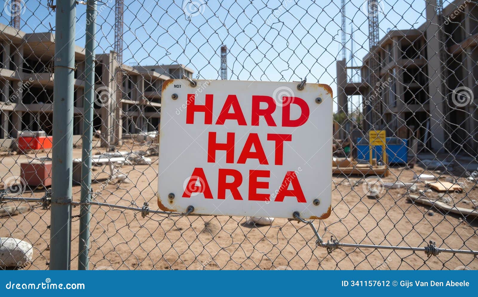 Construction Site Warning Sign on Metal Fence with Cranes and ...