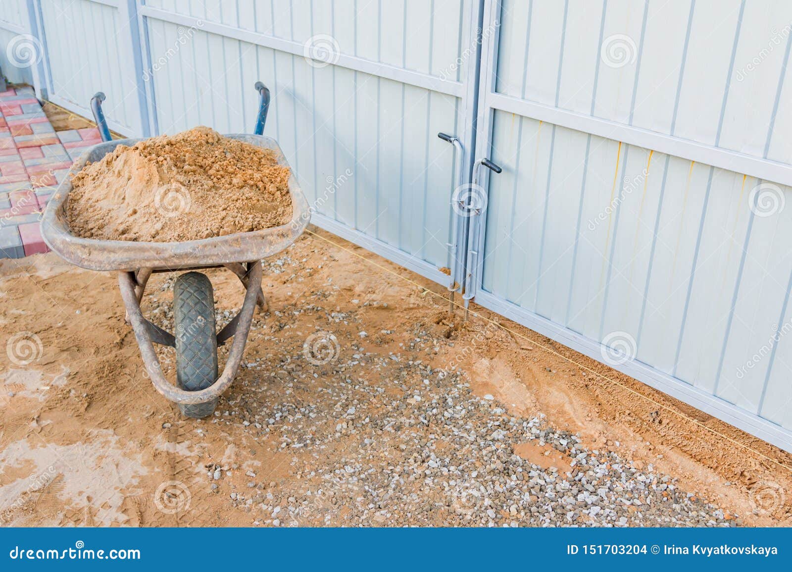 Construction Site with Wheel Barrow with Sand Stock Photo - Image of ...
