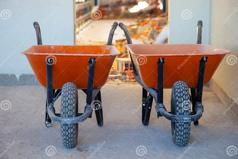 Construction Site with Wheelbarrows Ready for Work. Stock Image - Image ...