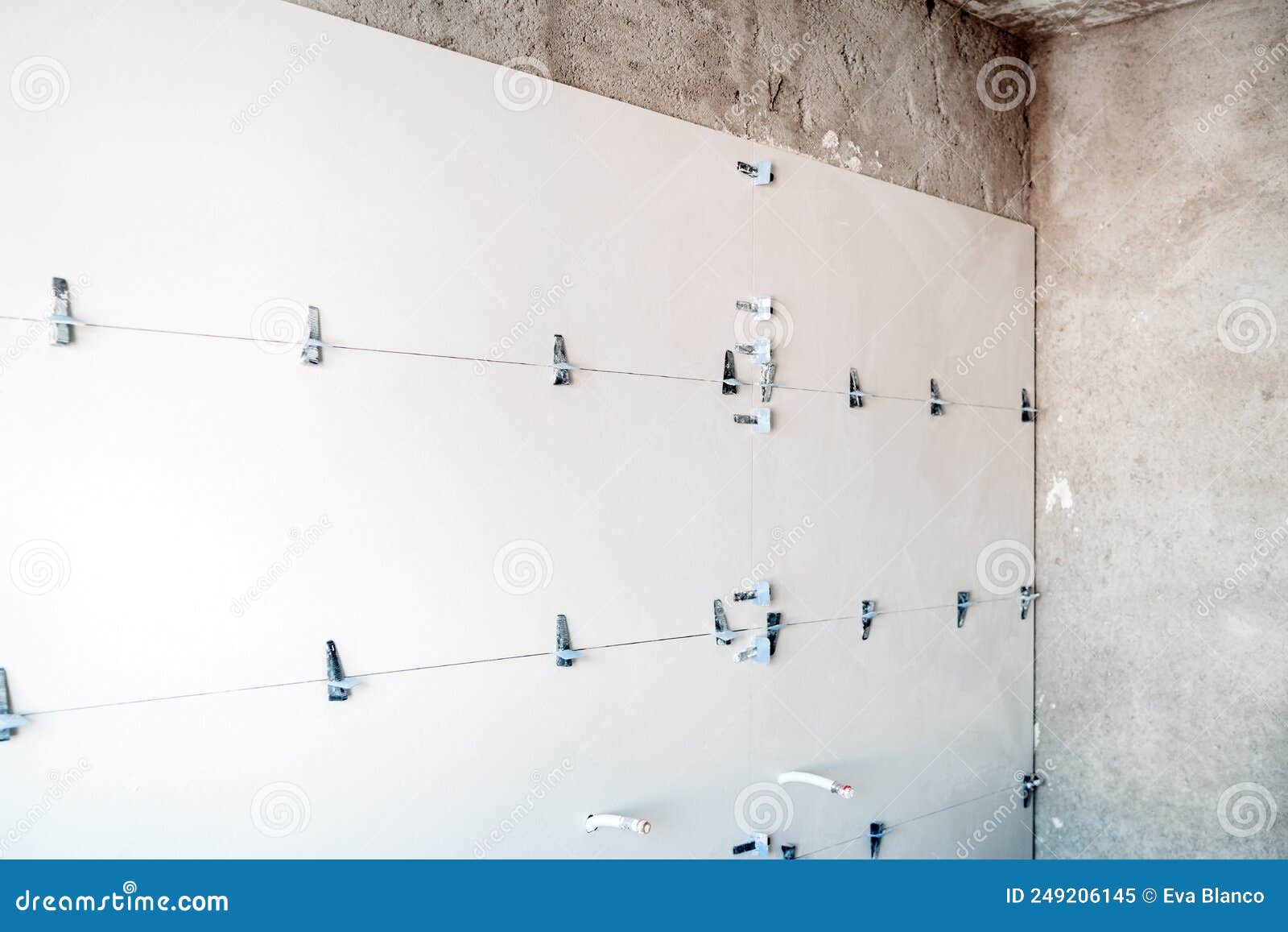 Construction Site. White Modern Tiles on Bathroom with Separator and ...