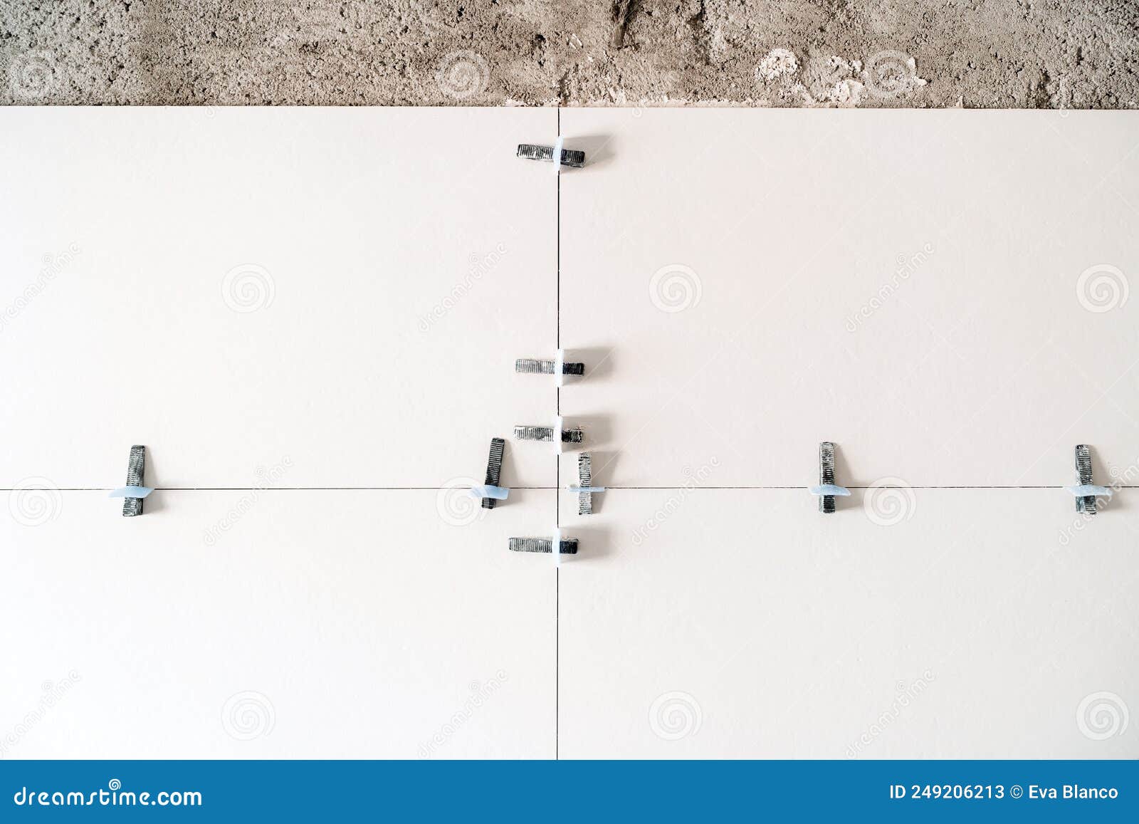 Construction Site. White Modern Tiles on Bathroom with Separator and ...