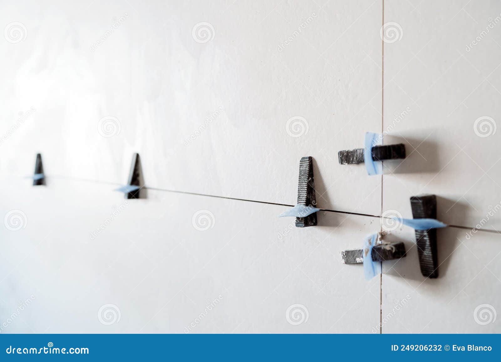 Construction Site. White Modern Tiles on Bathroom with Separator and ...