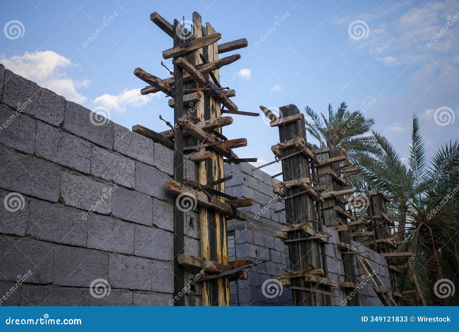 Construction Site with Wooden Scaffolding and Palm Trees Stock Image ...