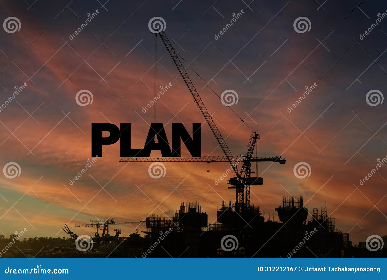 A Construction Site with the Word PLAN Written on a Crane. the Crane is ...