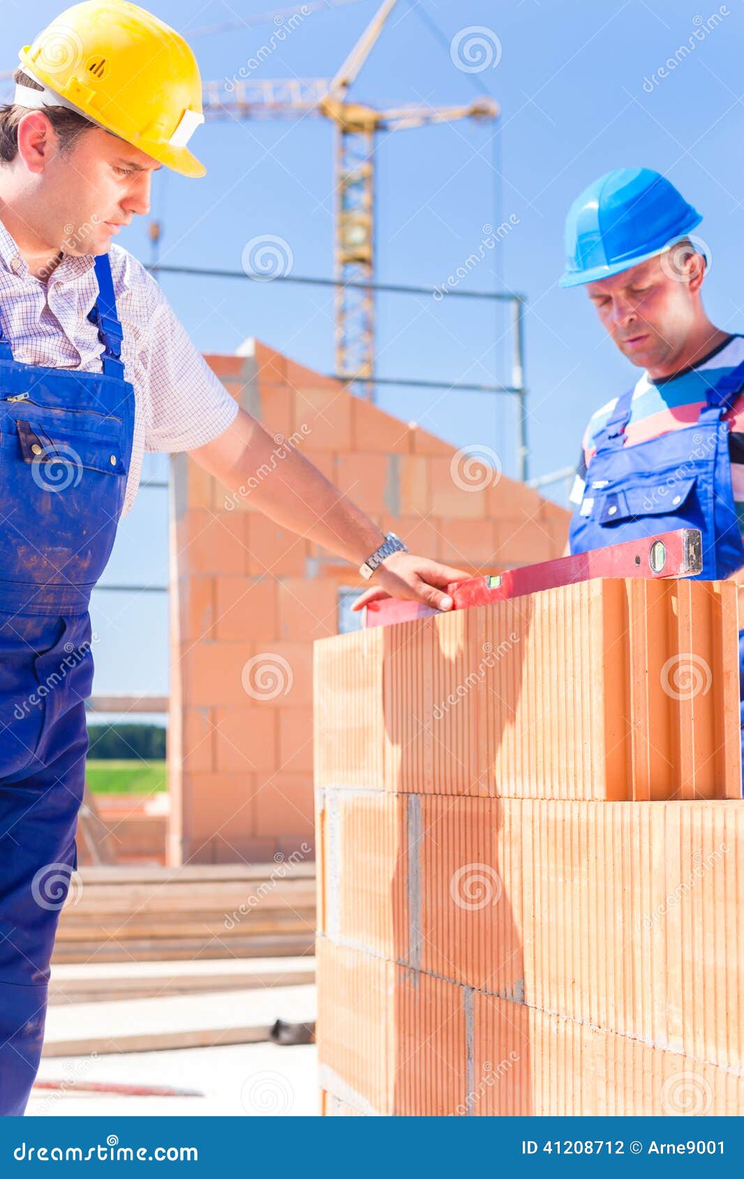 Construction Site Worker Checking Building Walls Stock Photo - Image of ...