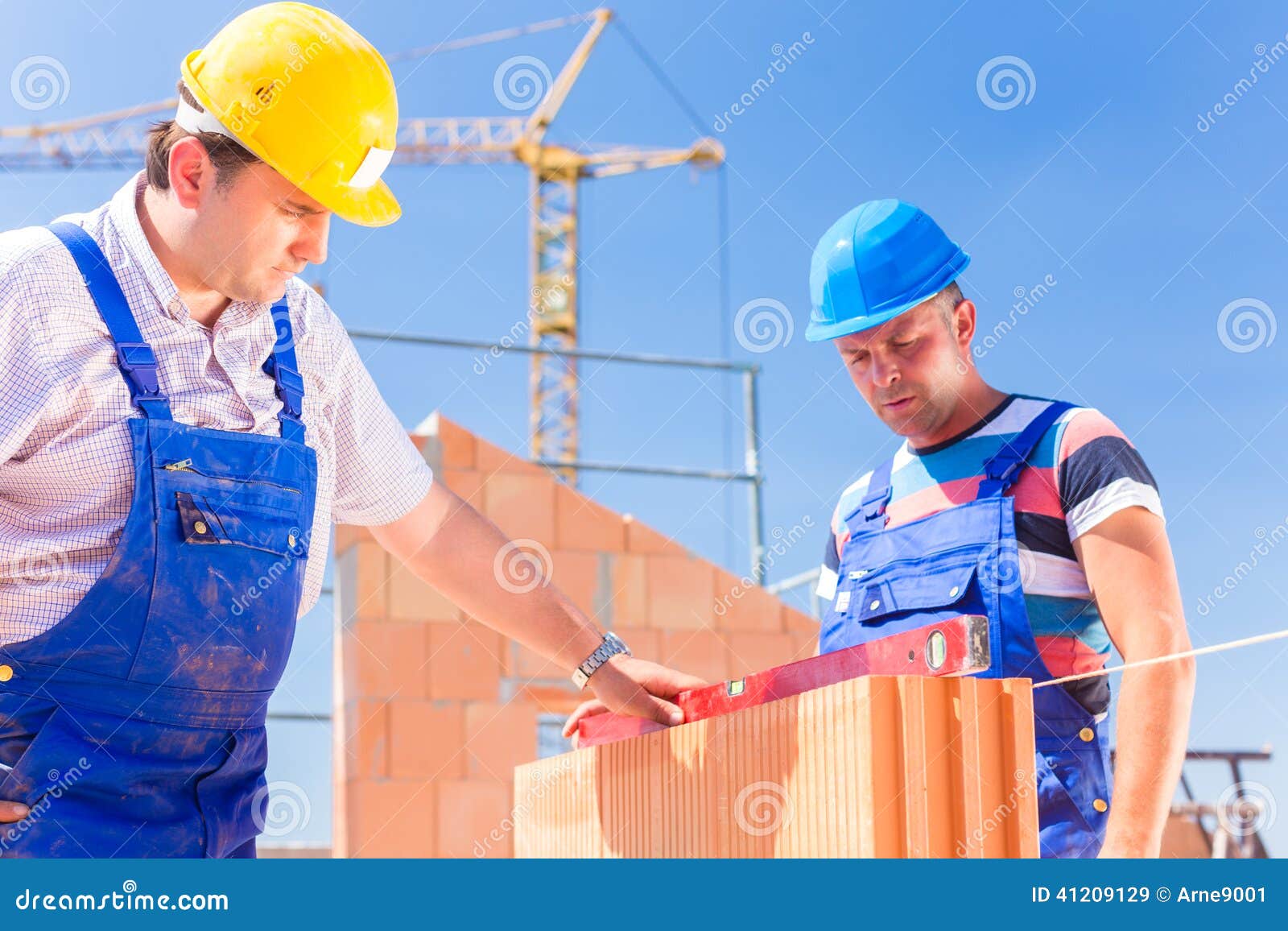 Construction Site Worker Checking Building Walls Stock Image - Image of ...