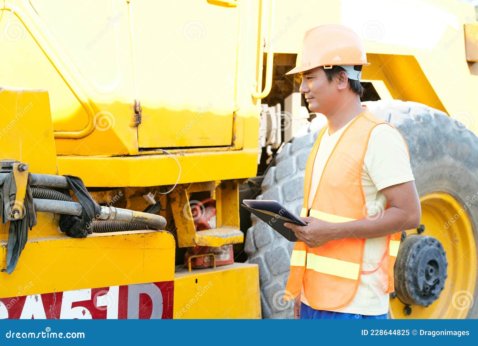 Construction Site Worker Checking Machines Stock Image - Image of ...