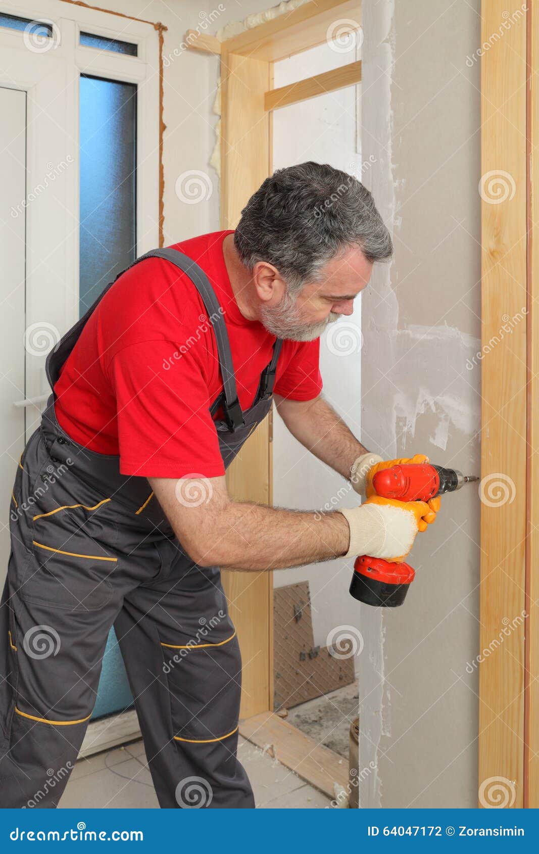 Construction Site, Worker Installing Gypsum Board Using Electric Stock ...
