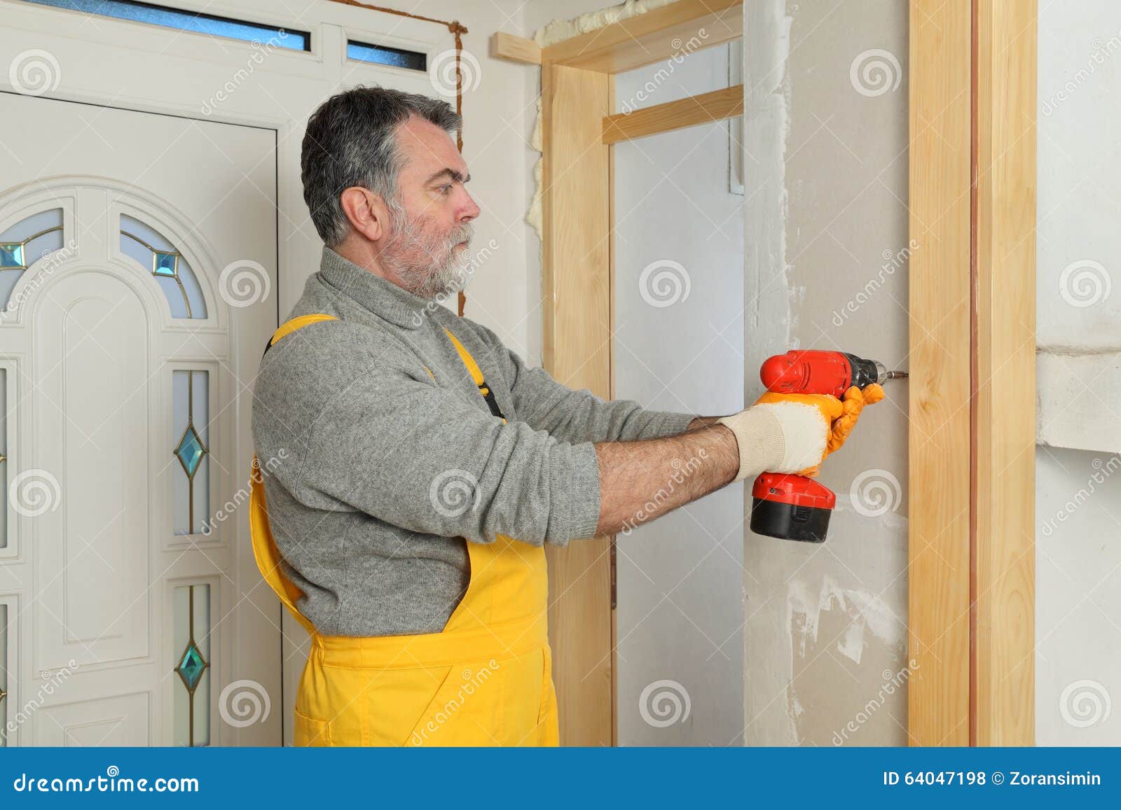 Construction Site, Worker Installing Gypsum Board Using Electric Stock ...