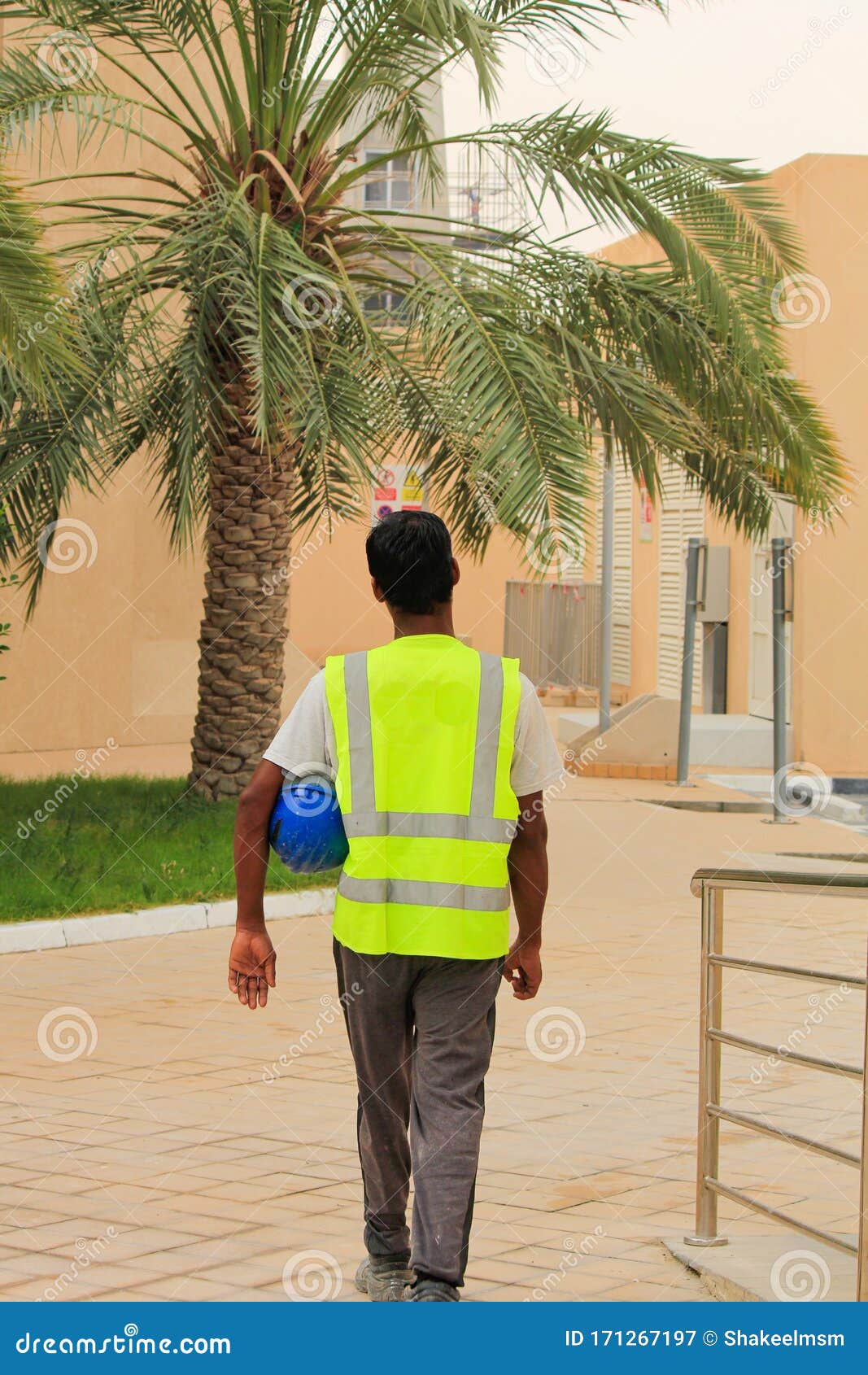 Construction Site Worker Walking for Work in Arab Country. Surveyor ... Construction Site Worker Walking for Work in Arab Country. Surveyor ...