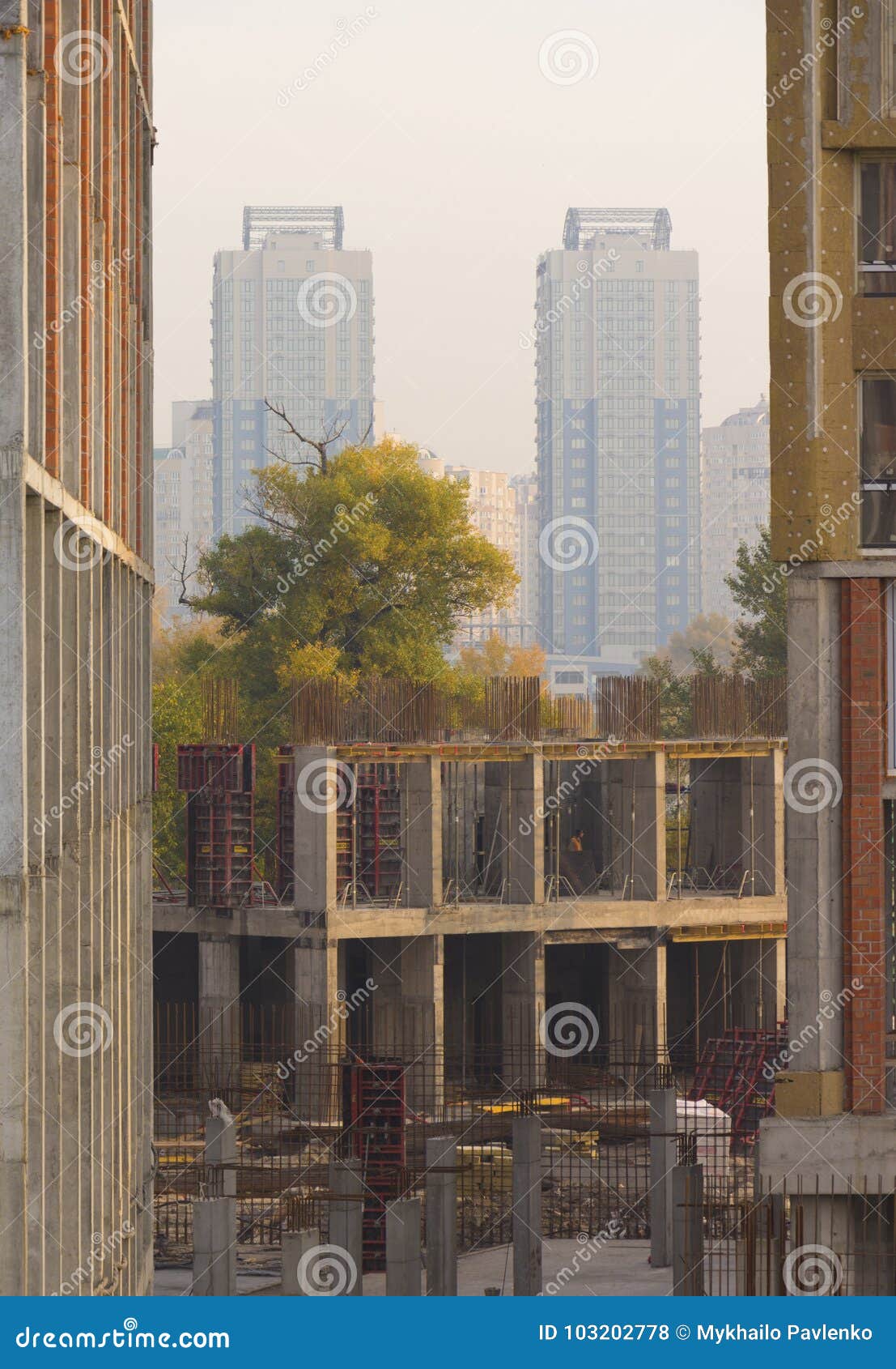 Workers On Aerial Work Platforms Build The Metal Structure Of The Roof ...