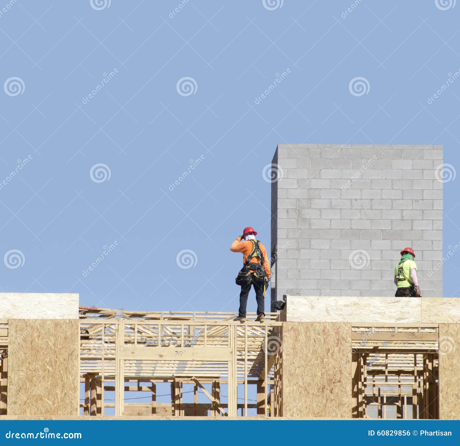 Construction Site Workers Building Roof on Apartment Complex Stock ...
