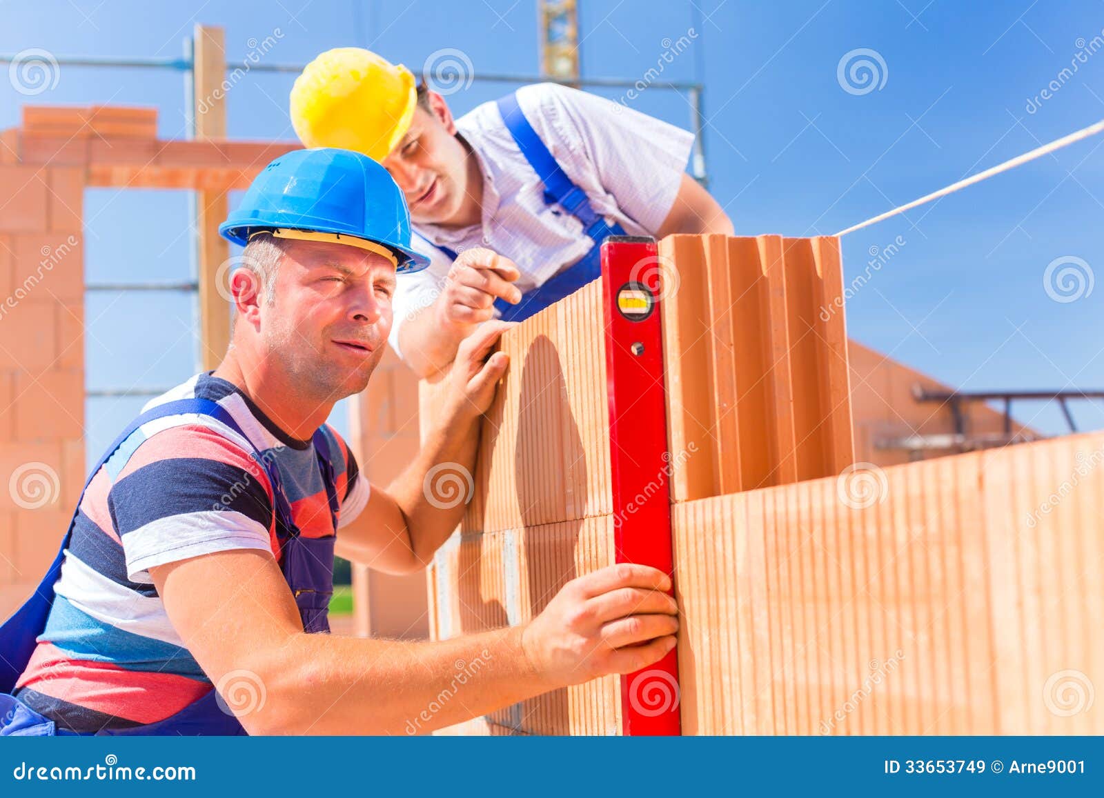Construction Site Workers Checking Building Shell Stock Image - Image ...