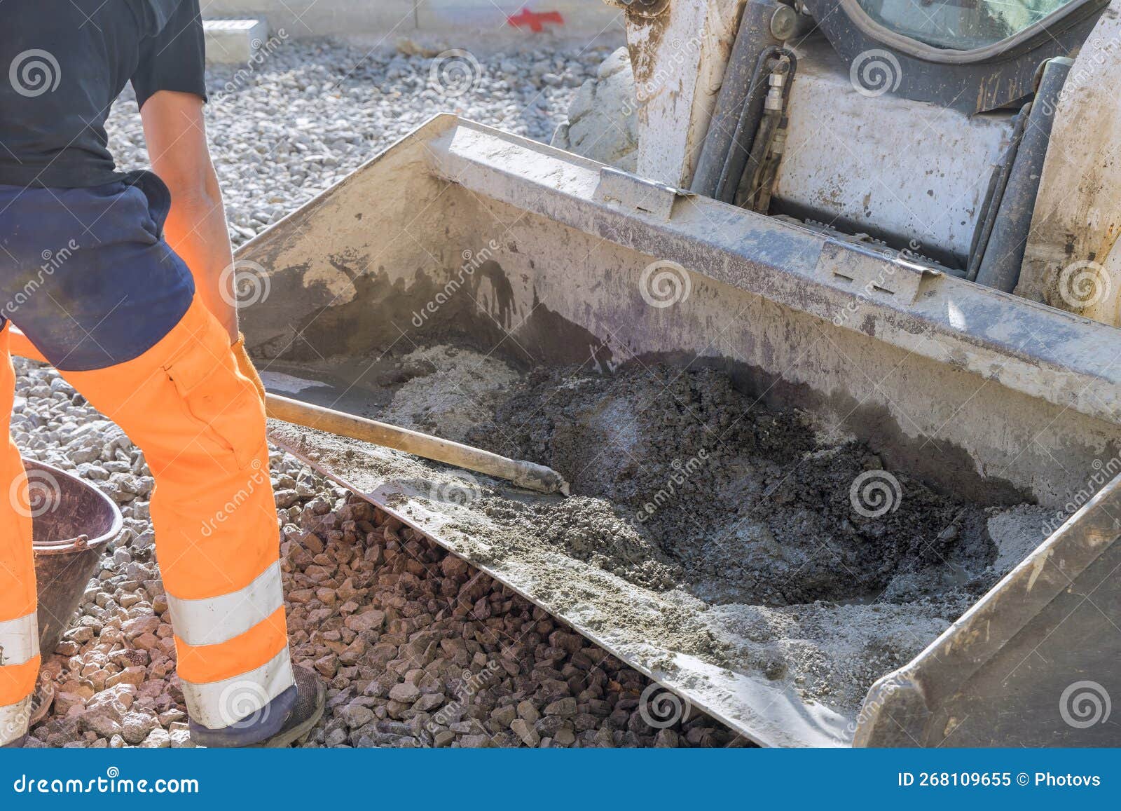 On a Construction Site, Workers Knead Cement Mortar into Buckets of an ...
