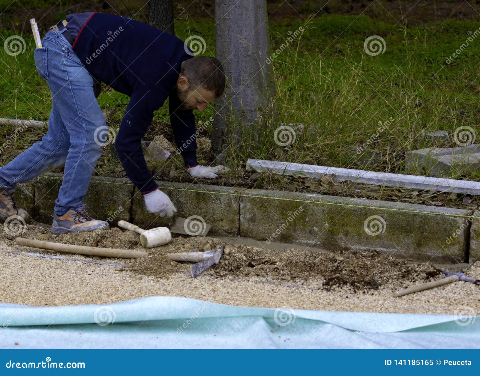 Workers Laying Concrete Curbs Stock Image - Image of bricklayer, shovel ...