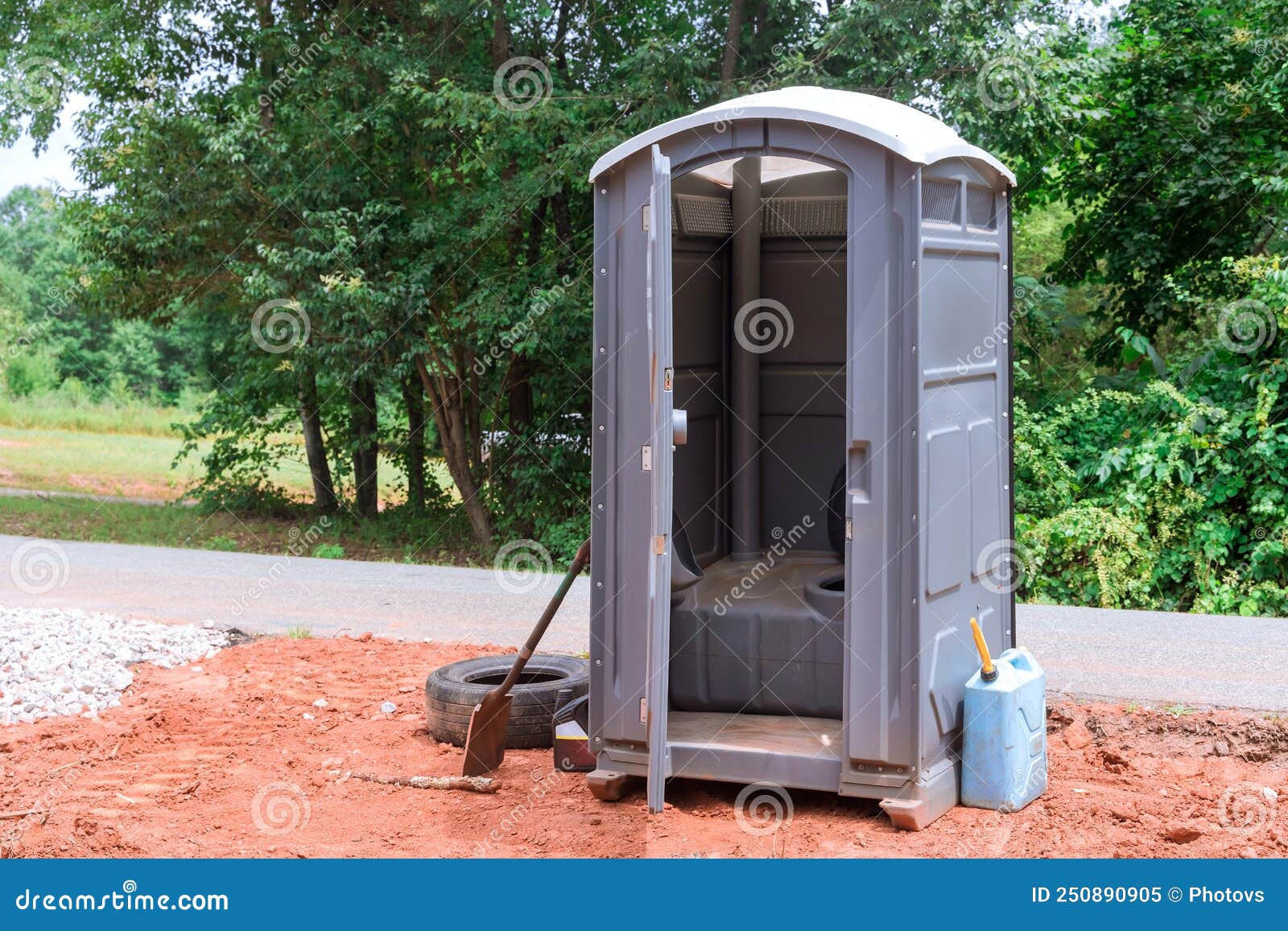 On a Construction Site, Workers Use a Portable Restroom Stock Image ...