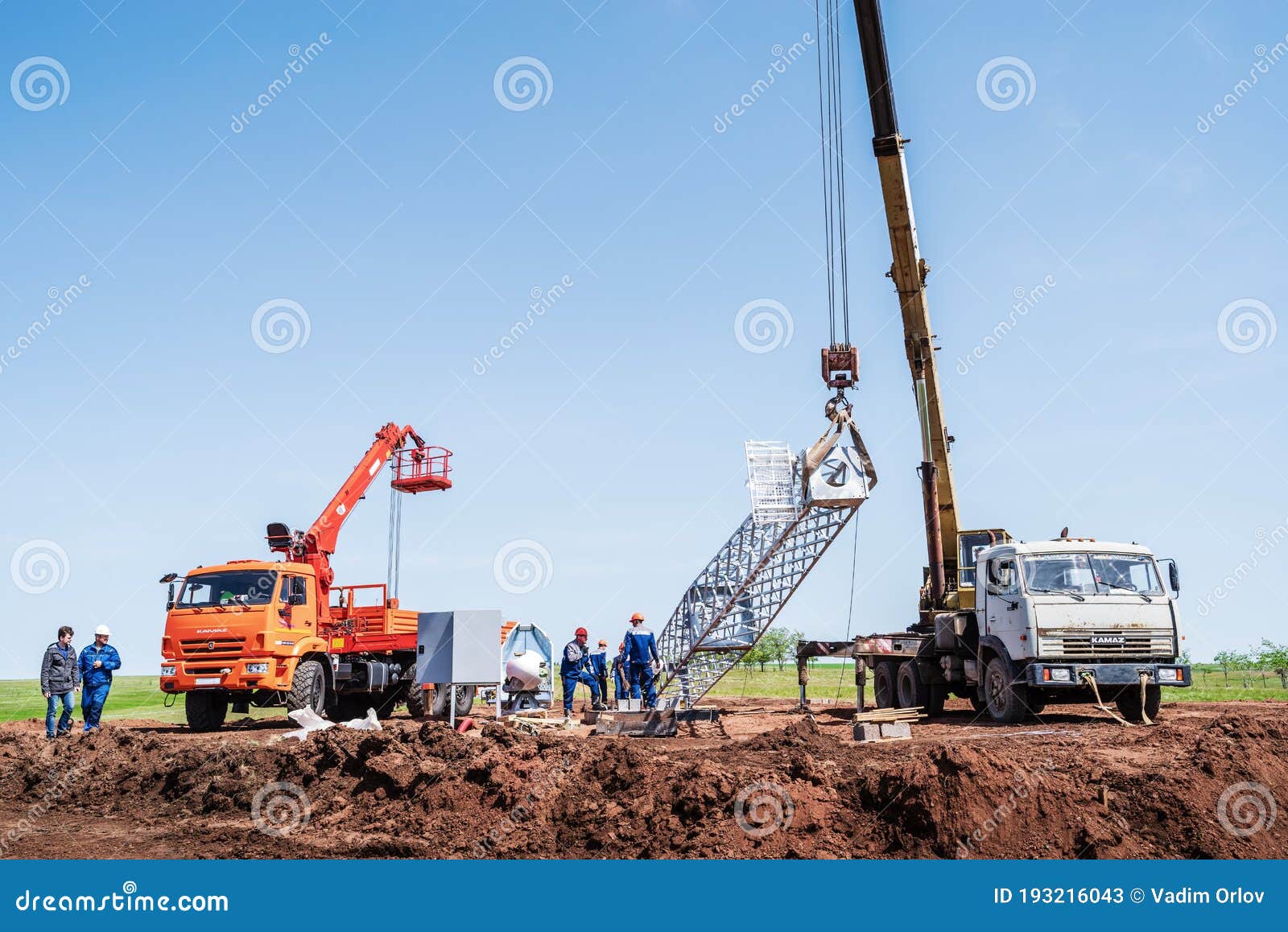 Construction Site, Workers Using Construction Equipment Install a Wind ...