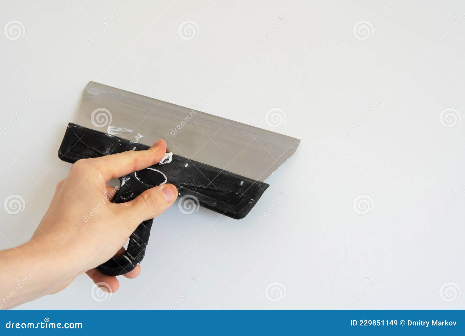 Construction Spatula for Leveling the Walls in the Hand of a Plasterer ...