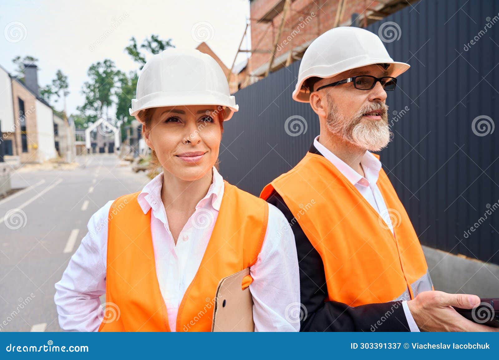 Construction Staff in Hard Hats Inspecting Development Site Stock Image ...
