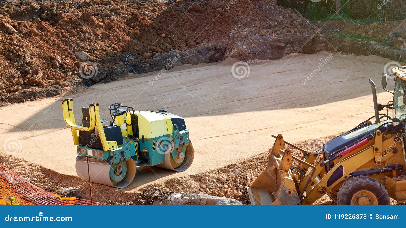 Construction Steamroller and Bulldozer on a House Construction Stock ...