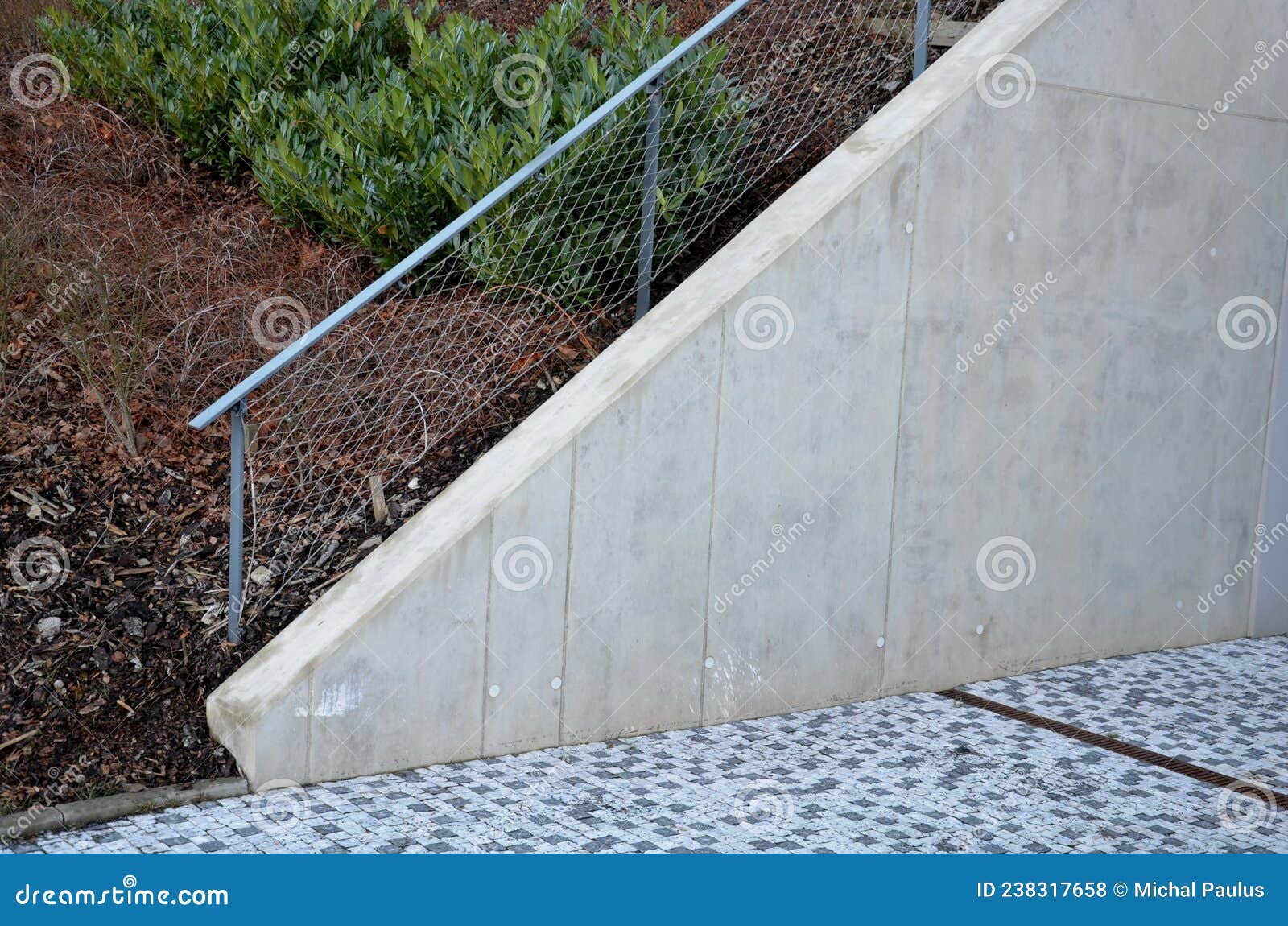 Construction of a Steep Staircase Near a Concrete Wall. Railing Above ...