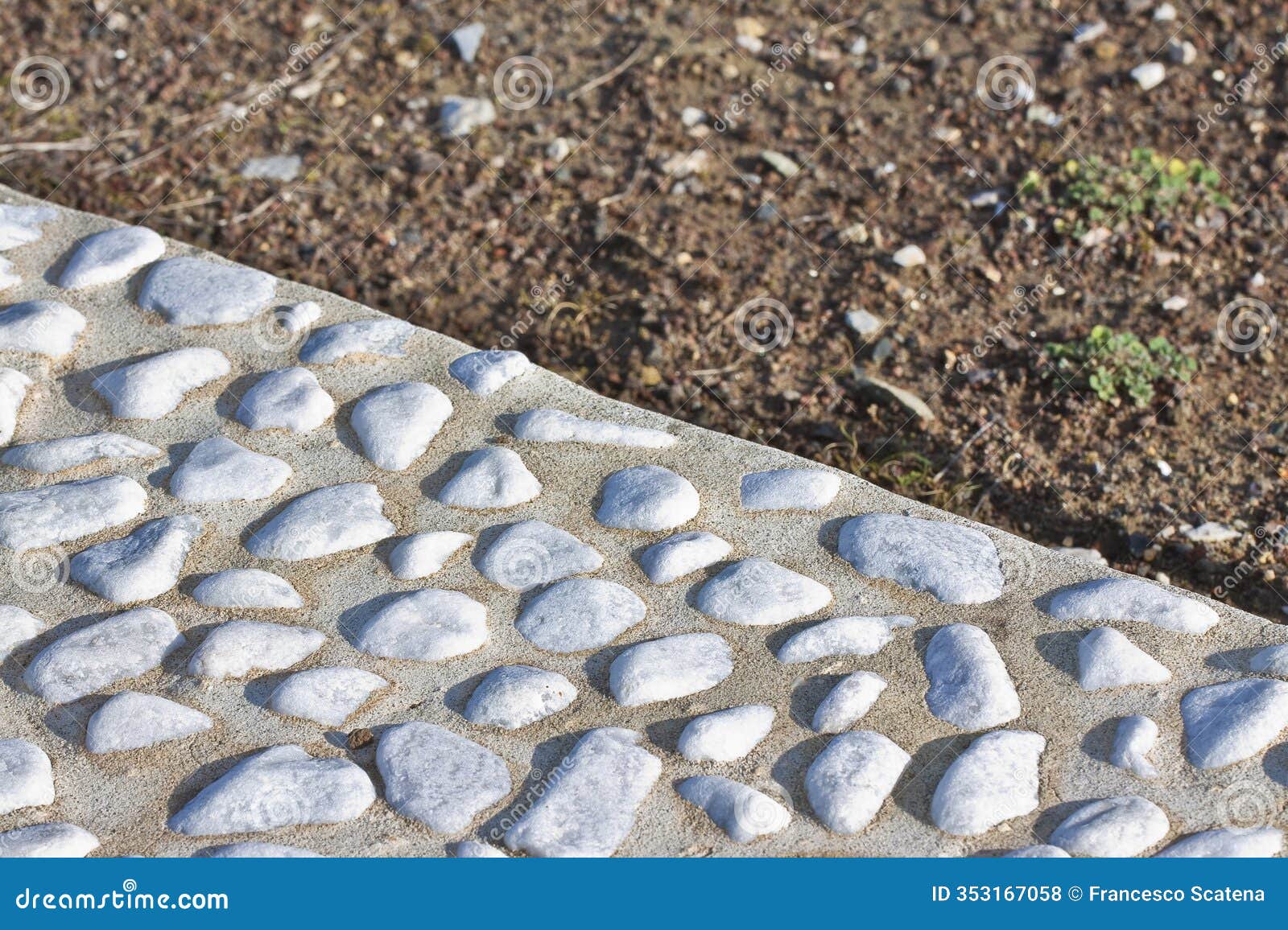 Construction of a Stone Pebble Pavement with a White Rounded Stone ...
