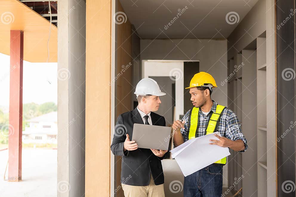 Construction and Structural Concept Engineers Working on Drawings at ...