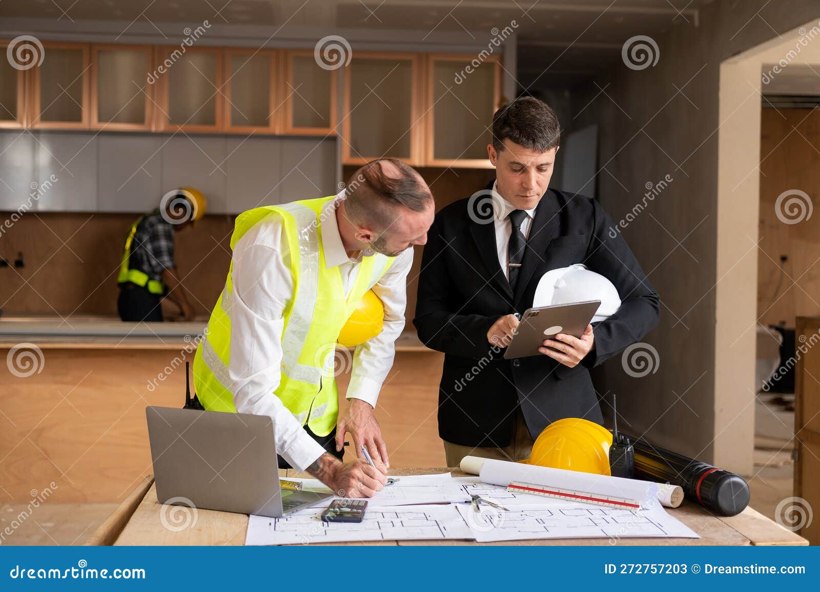 Construction and Structural Concept Engineers Working on Drawings at ...