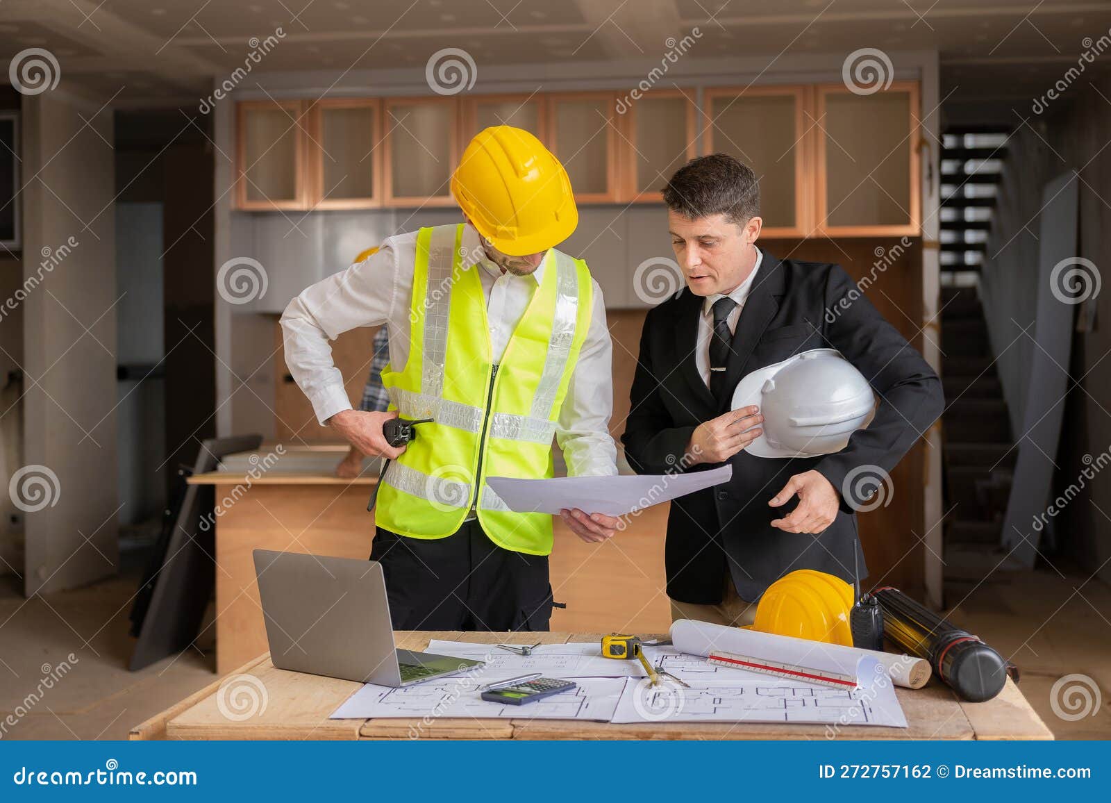 Construction and Structural Concept Engineers Working on Drawings at ...