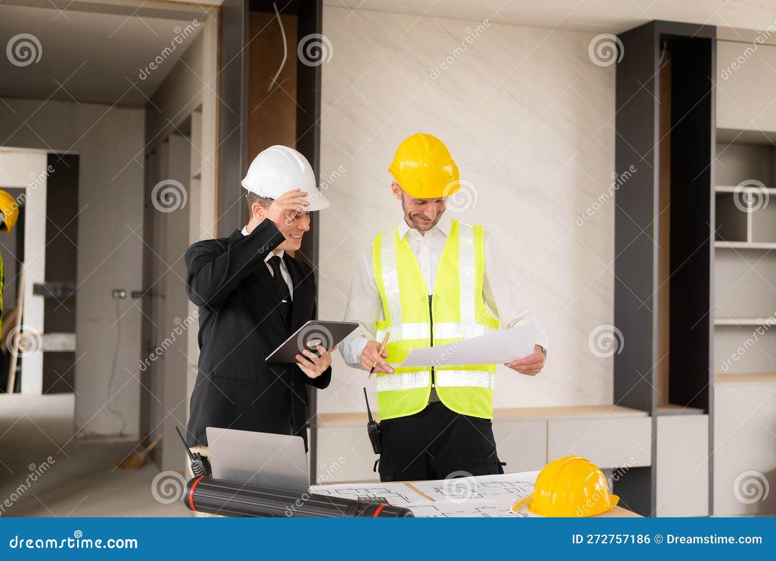 Construction and Structural Concept Engineers Working on Drawings at ...
