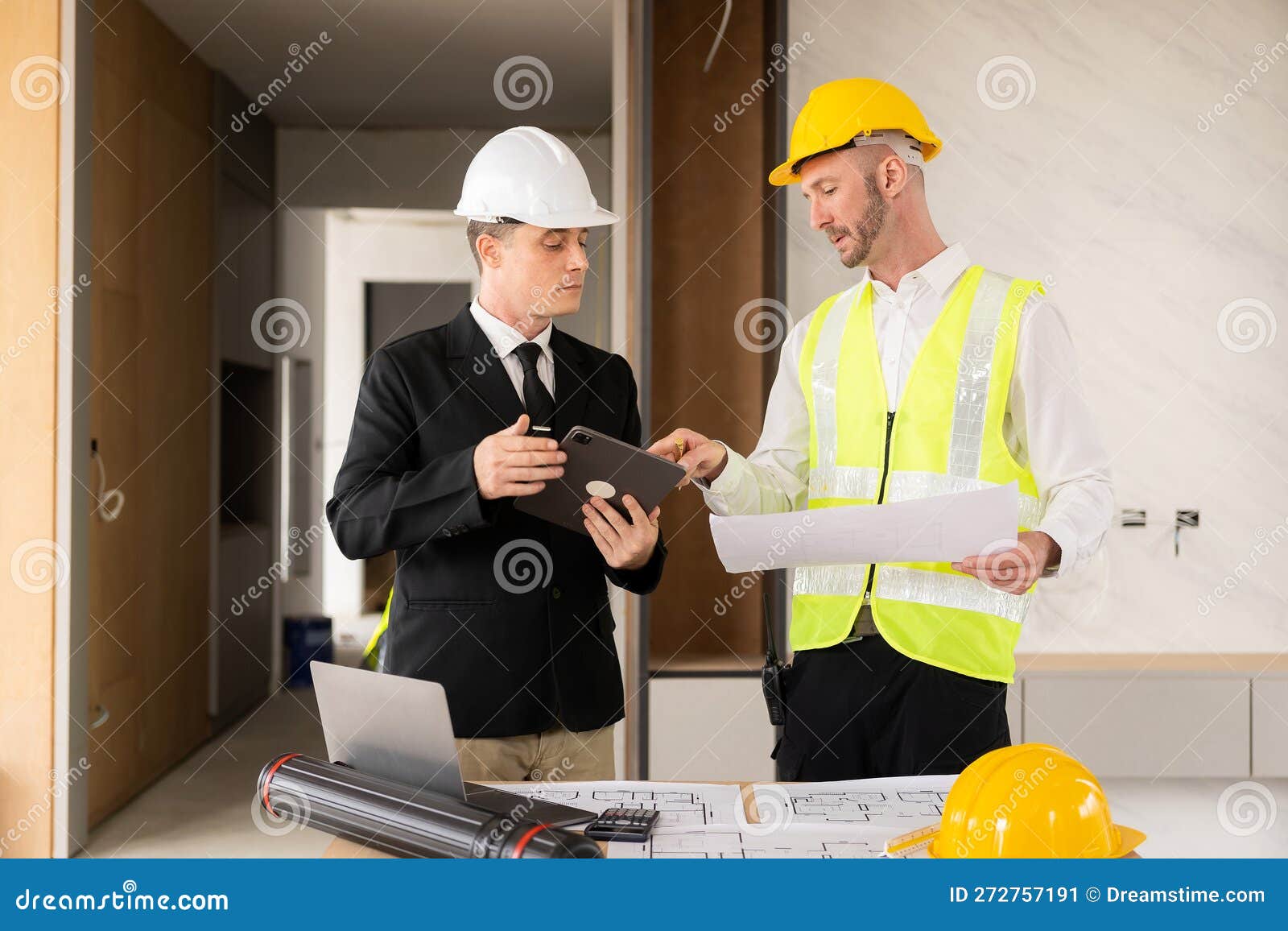 Construction and Structural Concept Engineers Working on Drawings at ...