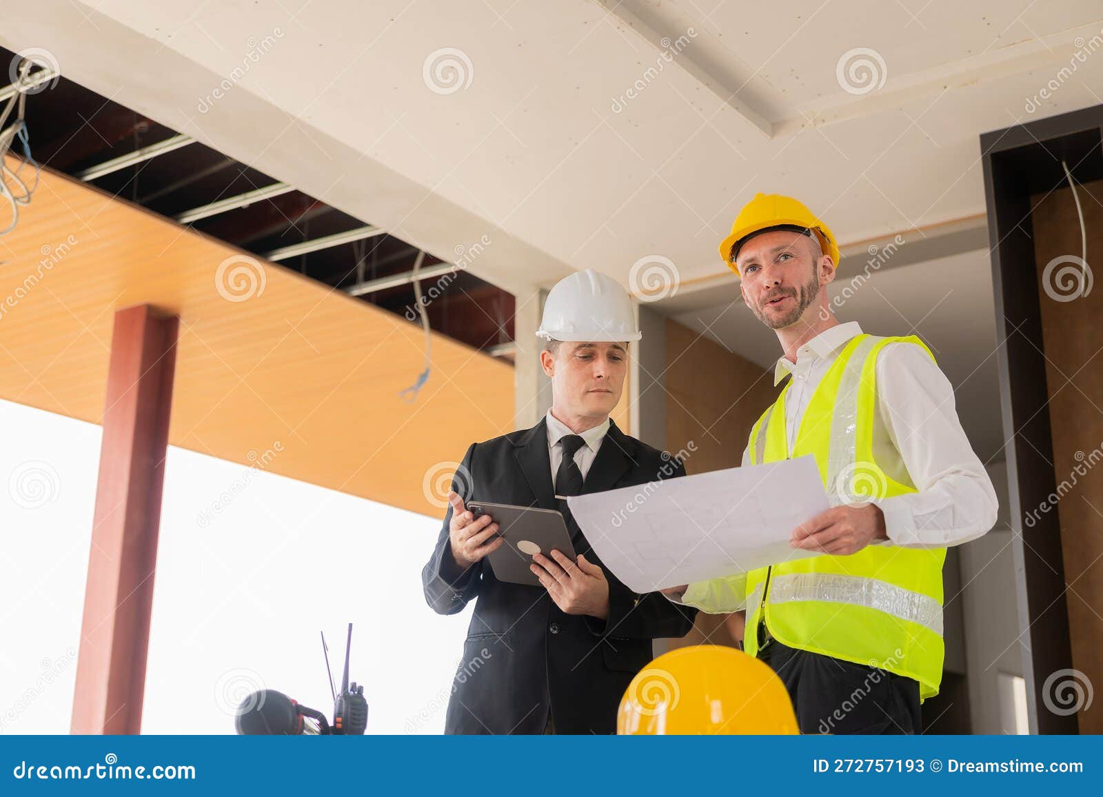 Construction and Structural Concept Engineers Working on Drawings at ...