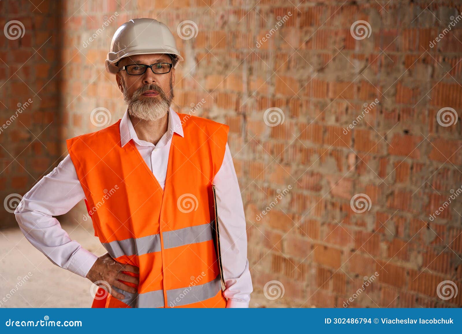 Construction Superintendent Posing for Camera before Building Site ...