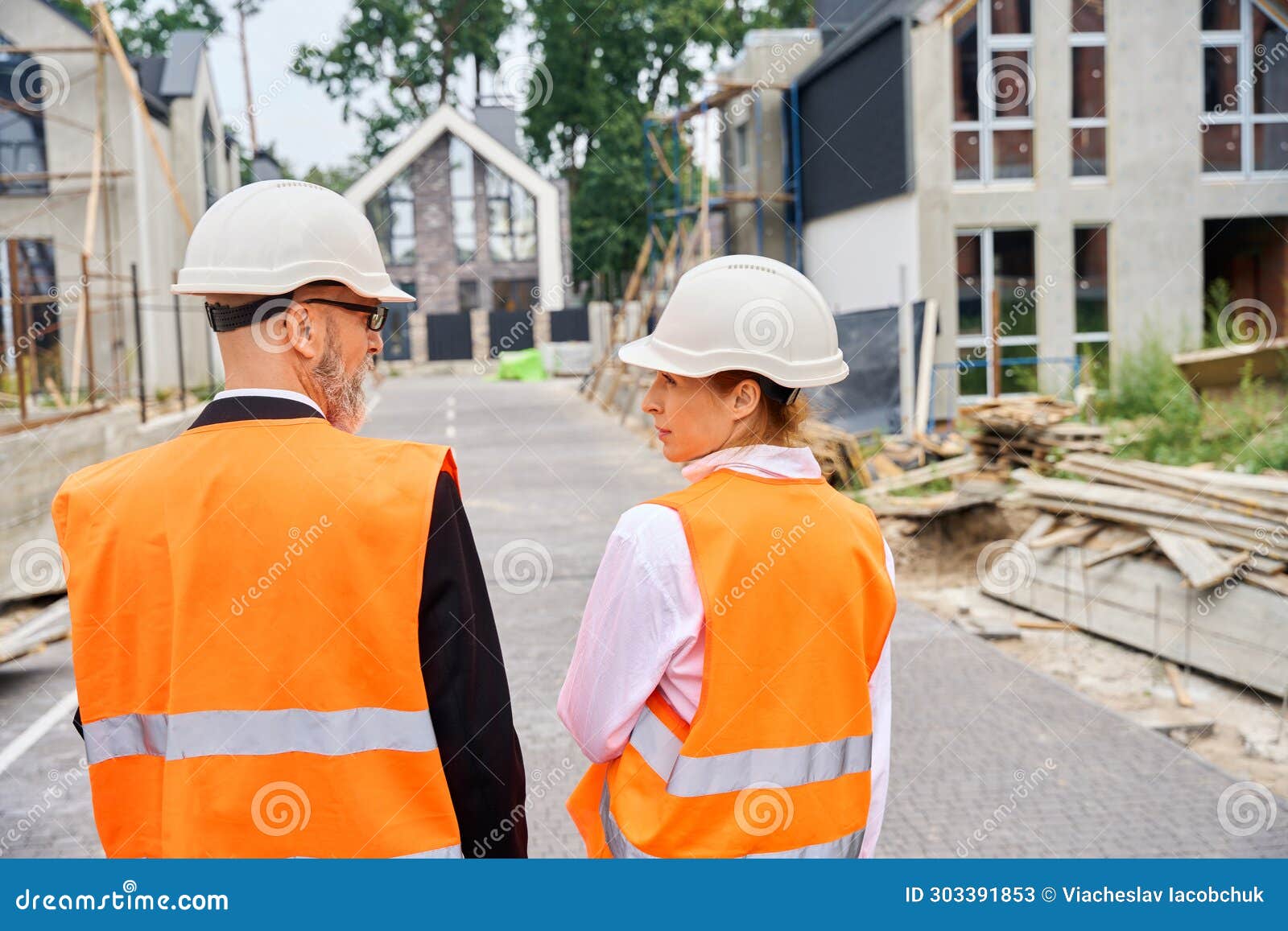 Construction Supervisor Communicating with Foreman during Site ...