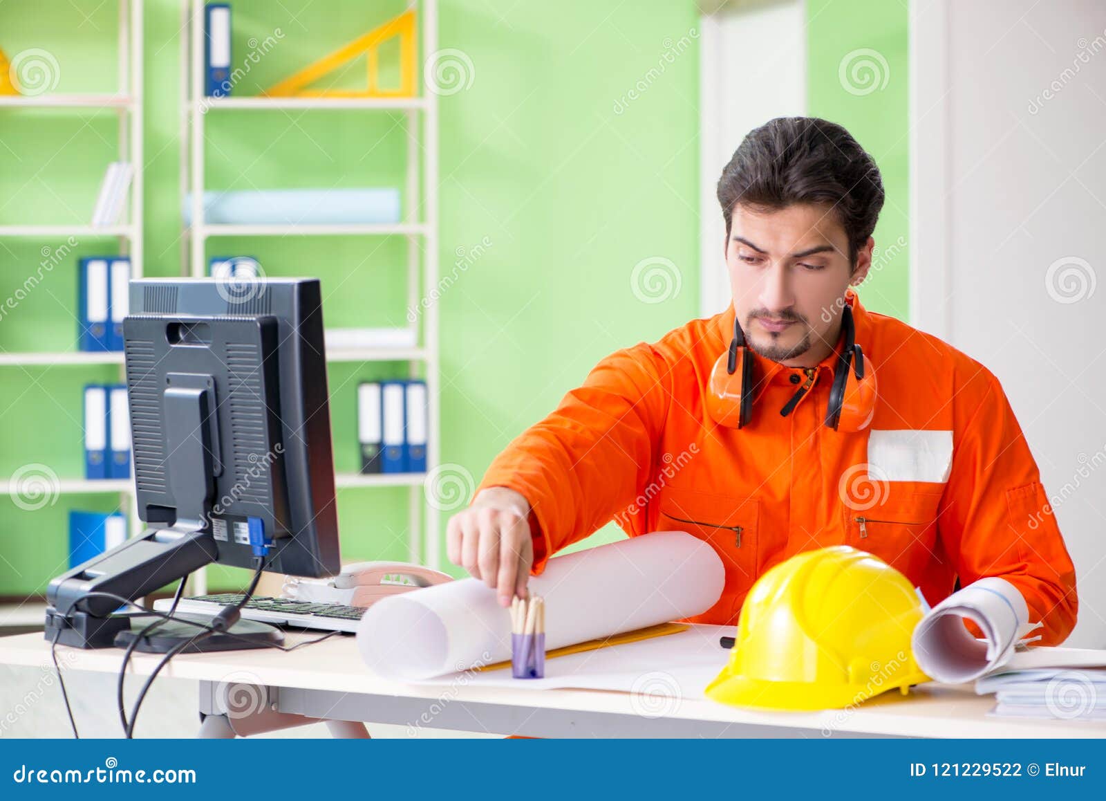 The Construction Supervisor Planning New Project in Office Stock Photo ...