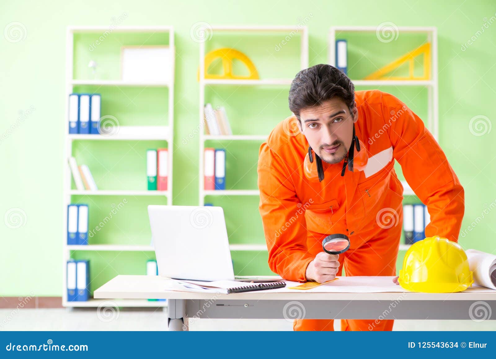 The Construction Supervisor Planning New Project in Office Stock Photo ...