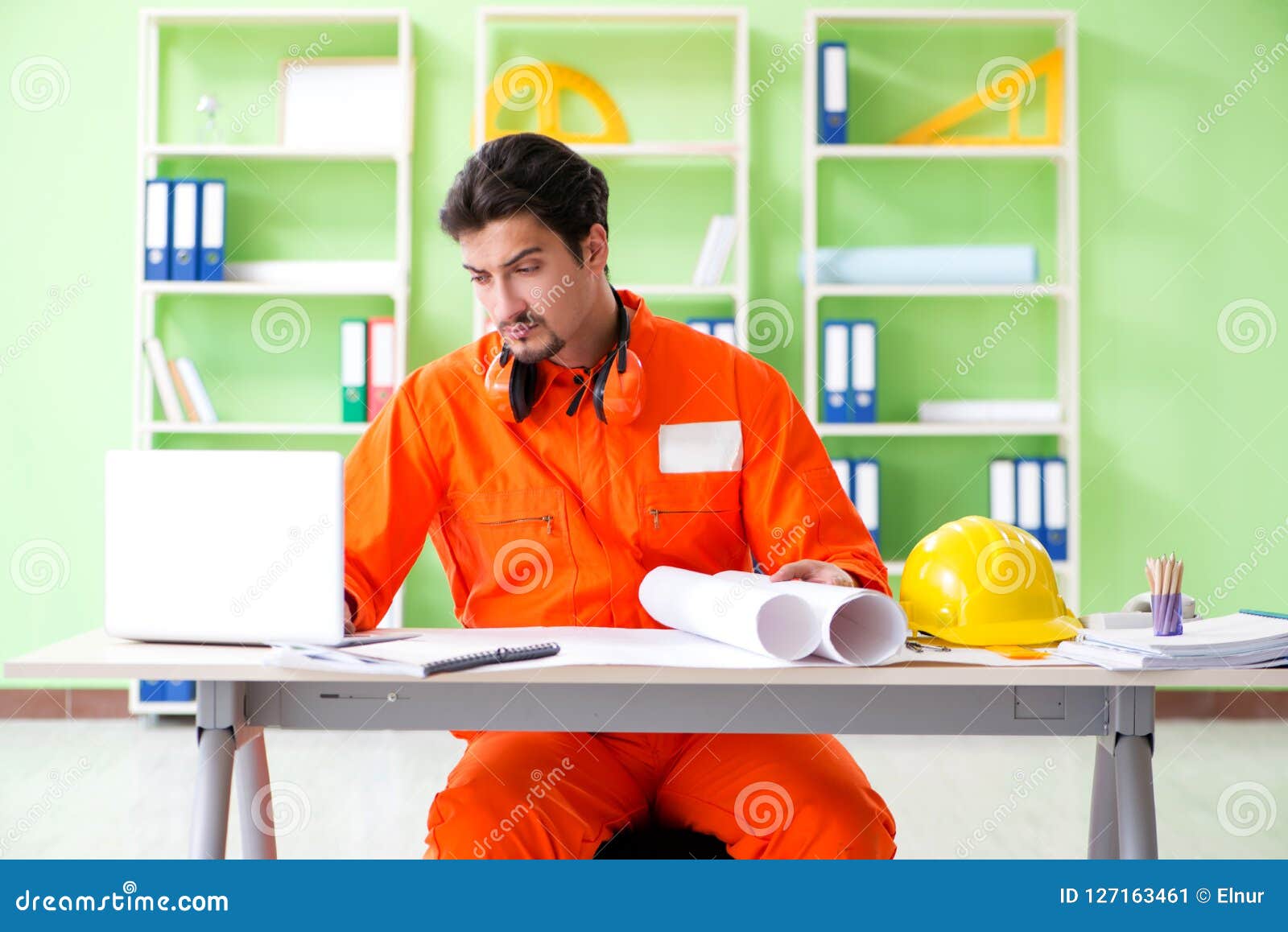 The Construction Supervisor Planning New Project in Office Stock Image ...