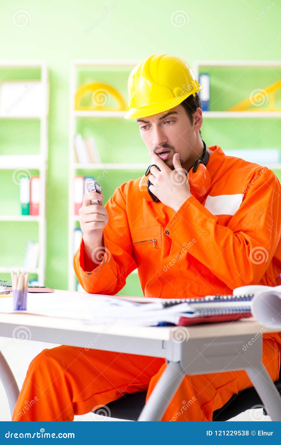 The Construction Supervisor Planning New Project in Office Stock Photo ...
