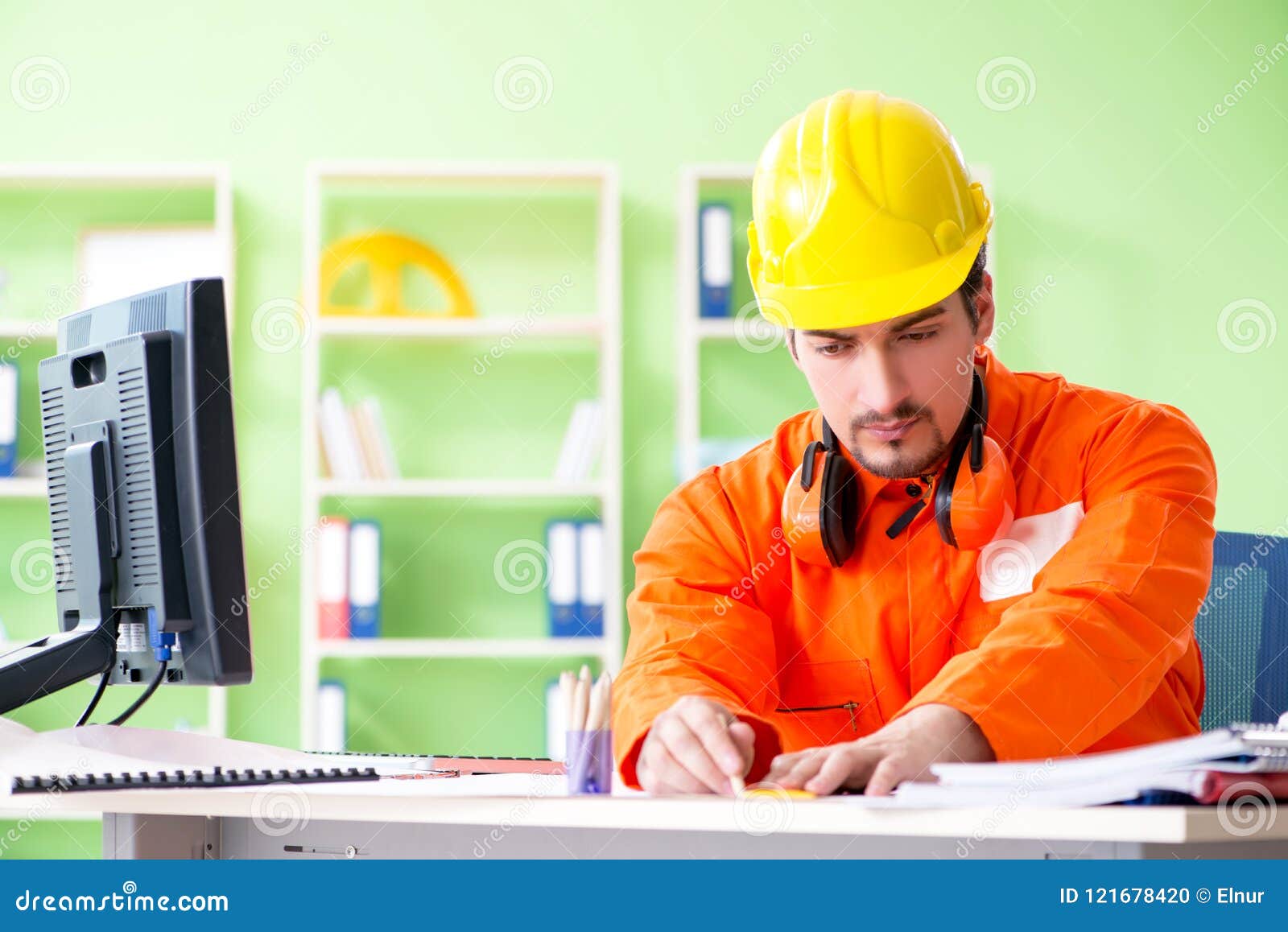 The Construction Supervisor Planning New Project in Office Stock Photo ...