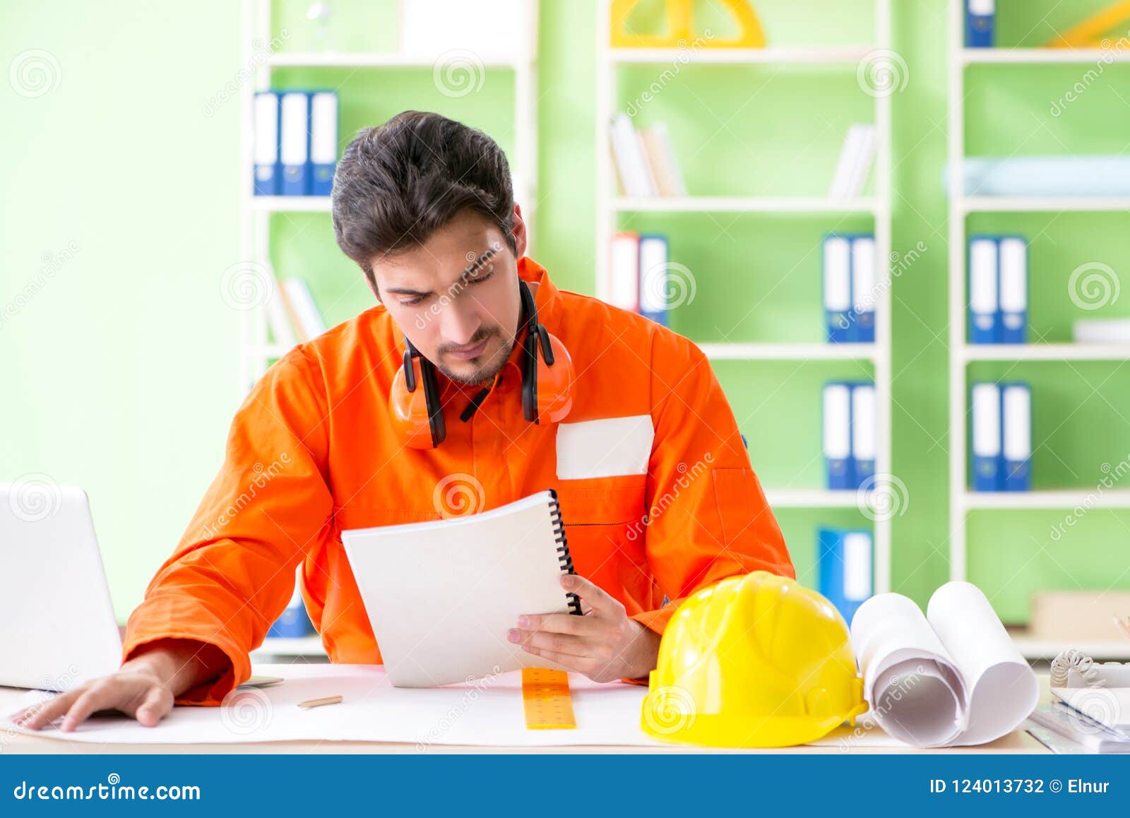 The Construction Supervisor Planning New Project in Office Stock Photo ...
