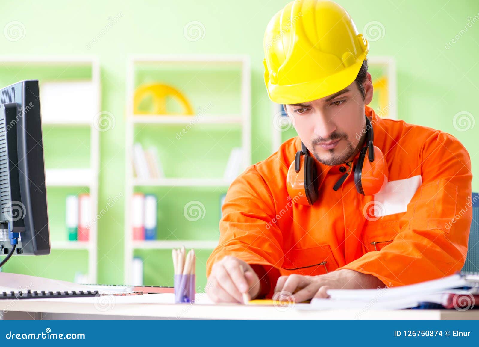 The Construction Supervisor Planning New Project in Office Stock Photo ...